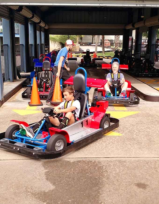 Young racers lined up like they're about to qualify for Daytona, complete with the safety gear and serious expressions.