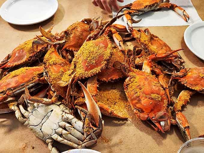 The main event: steamed crabs dusted generously with Old Bay, dumped unceremoniously on brown paper. Roll up your sleeves&mdash;this is going to get messy.