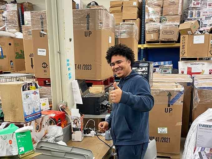 Nothing beats the satisfaction of scoring a great find, and this shopper's smile says it all about the thrill.