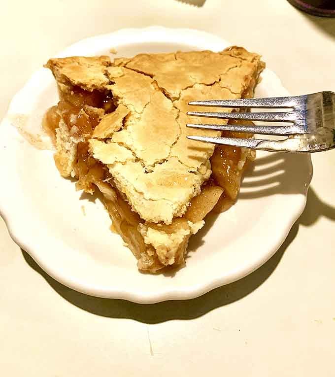 The apple pie arrives with that perfect golden-brown crust that makes you want to call your mother and apologize for ever doubting her recipe.