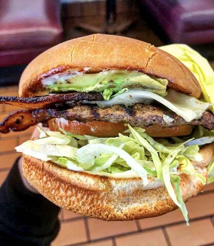 This isn't just a burger, it's a masterpiece of balance&mdash;crisp bacon, fresh avocado, and a perfectly charred patty that would make any Californian proud.