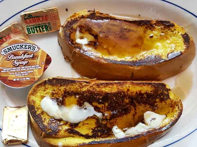 Challah French toast so thick and golden, it could make a grown adult weep tears of pure breakfast joy.