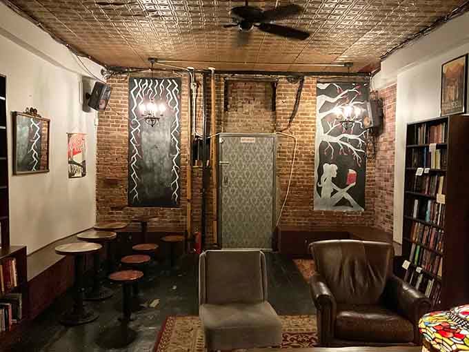 Exposed brick, vintage art, and comfy seating create the living room you wish you had growing up.