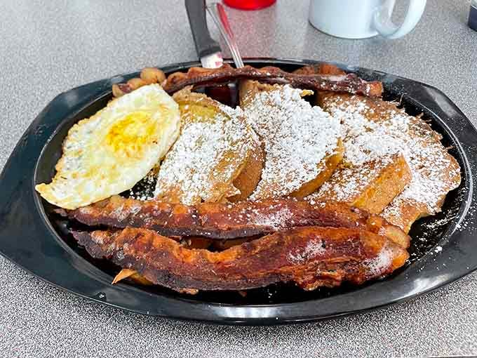 Powdered sugar French toast and crispy bacon—proof that breakfast is the meal most likely to make you believe in a benevolent universe.