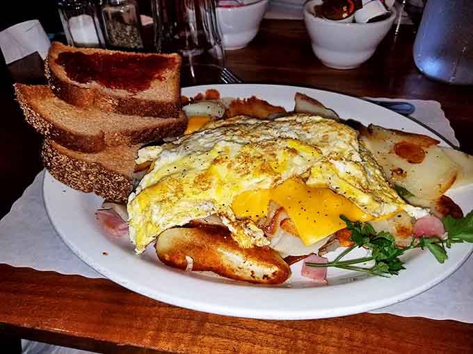 Breakfast nirvana achieved: eggs that look like they were laid this morning, potatoes crisped to perfection, and toast ready for its supporting role.