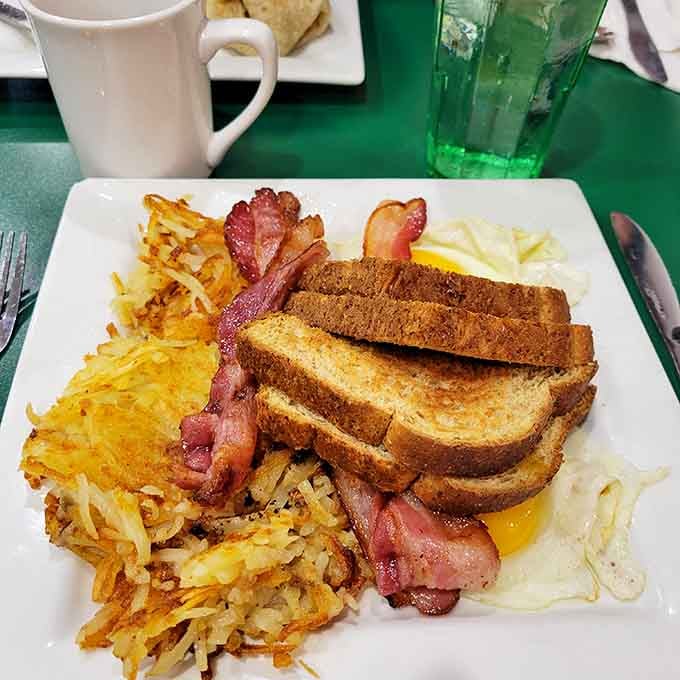 Breakfast doesn't get more honest than this&mdash;crispy hash browns, perfectly cooked eggs, bacon that stands at attention, and toast ready for its butter bath.