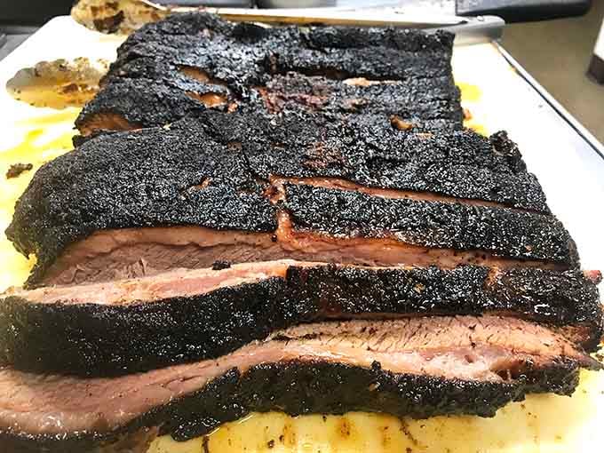 This brisket's bark is like nature's candy&mdash;dark, mysterious, and hiding that perfect pink smoke ring that makes BBQ aficionados weak in the knees.