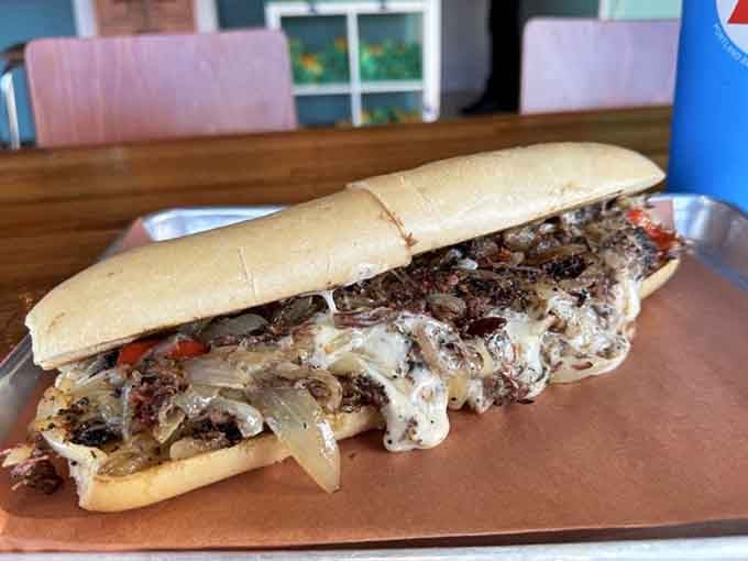 That brisket cheesesteak stretches the length of the roll, loaded with tender meat and melted cheese.