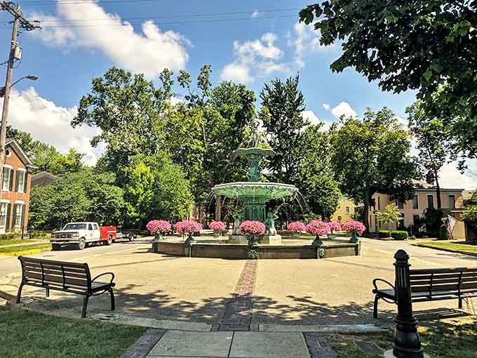 Broadway Fountain stands as Madison's crown jewel, surrounded by vibrant flowers that seem to be showing off for their cast-iron centerpiece.