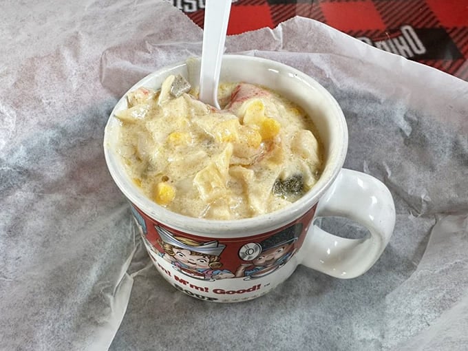 Spicy crab bisque served in a vintage mug because even soup deserves to feel nostalgic and warm.