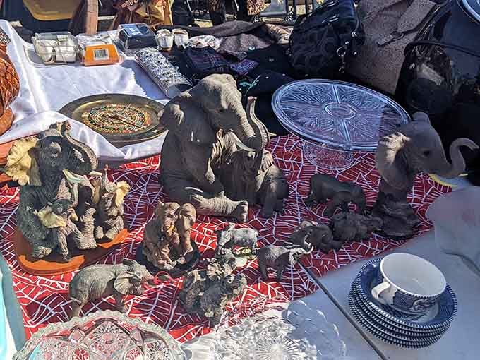 Elephant figurines congregate like they're planning their own flea market takeover, one trunk at a time.
