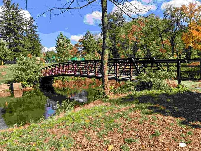 That picturesque footbridge in Cadwalader Park isn't just crossing water—it's spanning the gap between urban living and natural beauty without crossing into financial distress.
