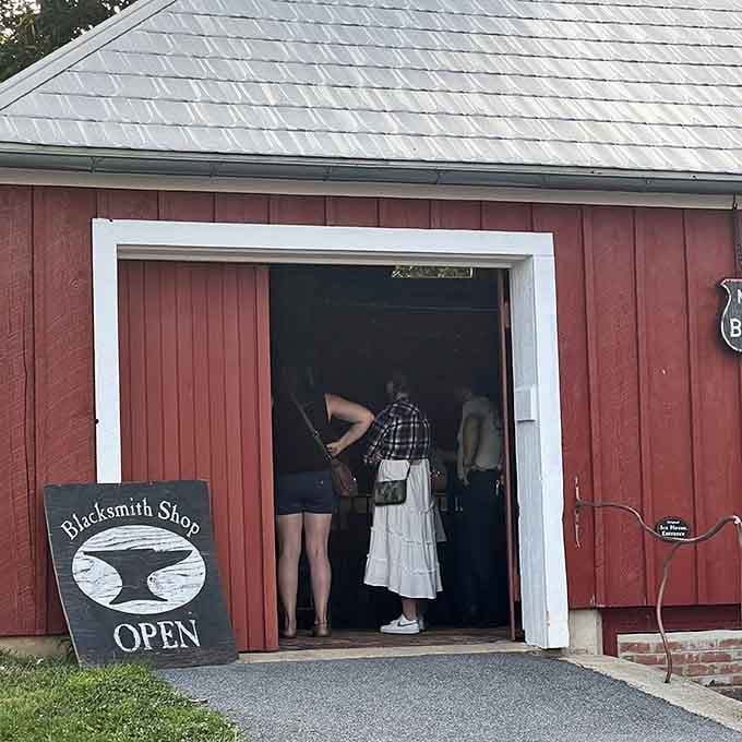 The blacksmith shop beckons with promises of sparks, skill, and the satisfying clang of honest work being done.