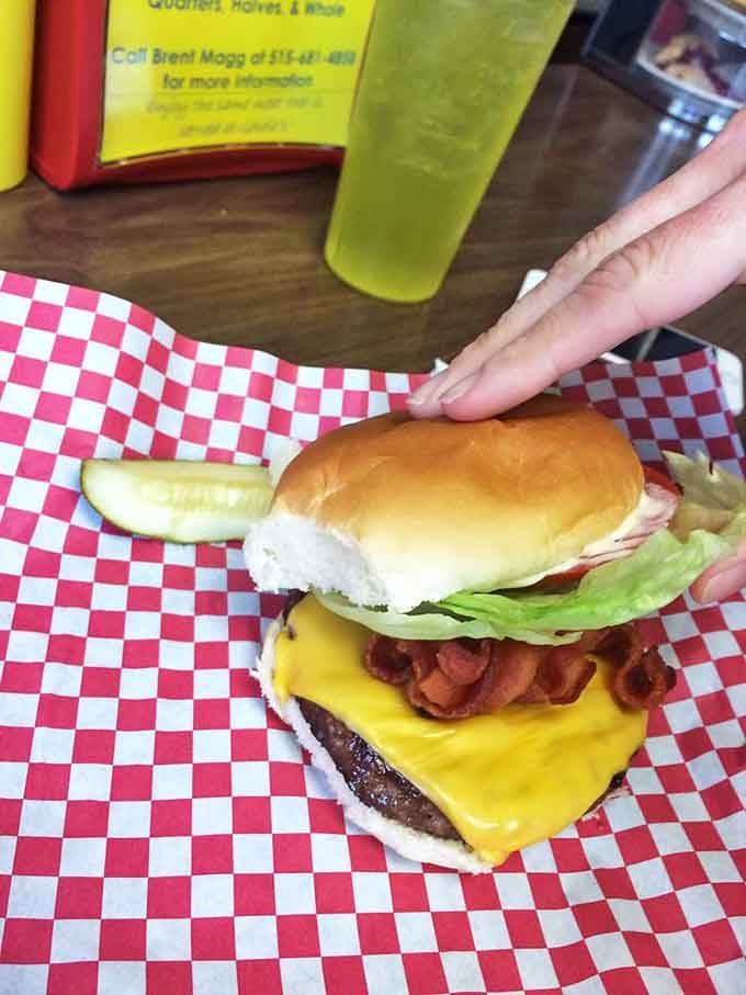 This isn't just a cheeseburger&mdash;it's edible architecture. The melted cheese cascades over the patty like a yellow waterfall of happiness.