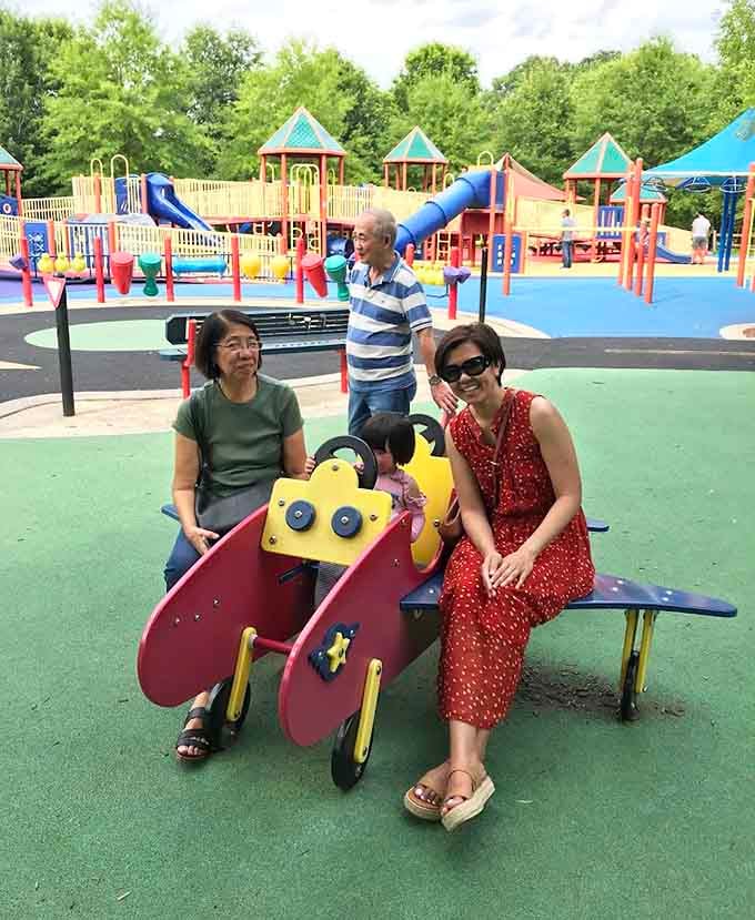 Three generations discovering that joy has no age limit when the playground welcomes absolutely everyone who shows up.