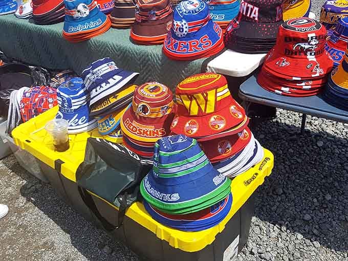 Sports team bucket hats lined up like a rainbow of fandom, ready for tailgating season glory.