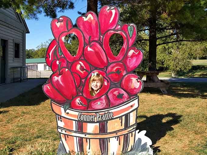 Nothing says "I was here" quite like sticking your face through a barrel of apples for posterity's sake.