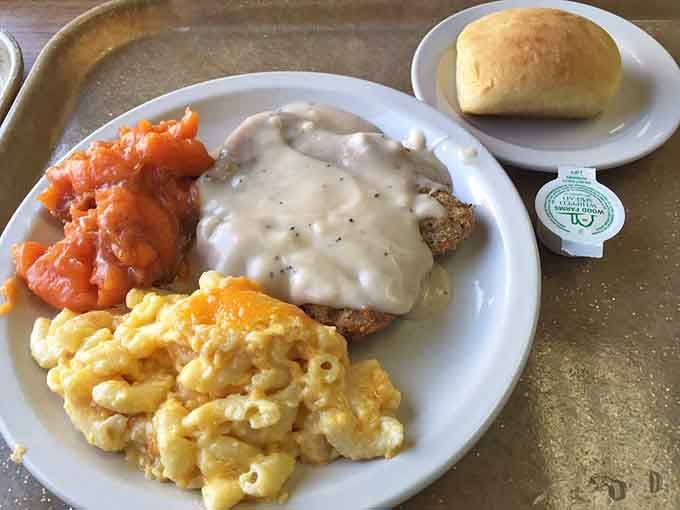 Country fried steak swimming in pepper-flecked gravy alongside mac and cheese that's achieved that perfect orange glow of Southern happiness.