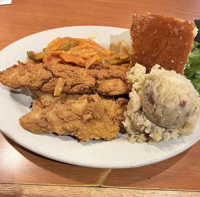 This plate proves that sometimes the best things in life are breaded, fried, and served with exceptional sides.