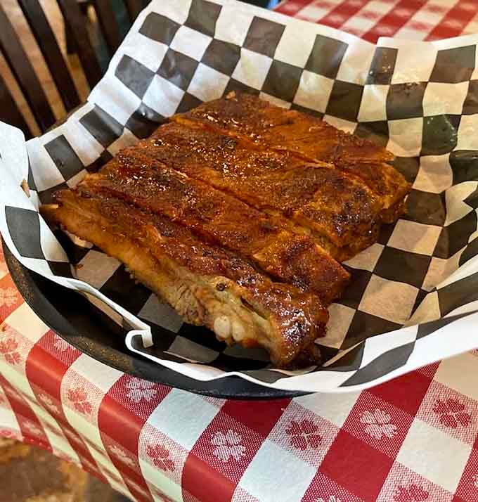 Ribs so tender they're practically waving goodbye to the bone before you even pick up your fork.
