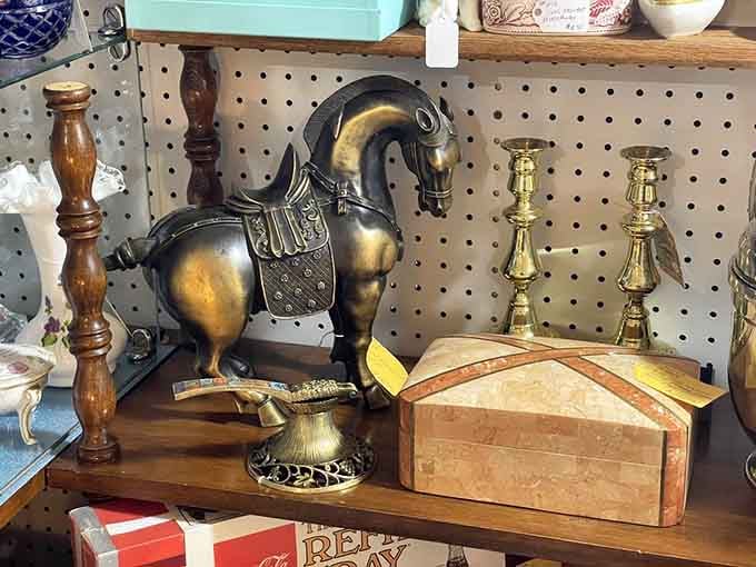 That brass horse sculpture commands attention like a trophy from some forgotten equestrian championship your uncle never mentioned.