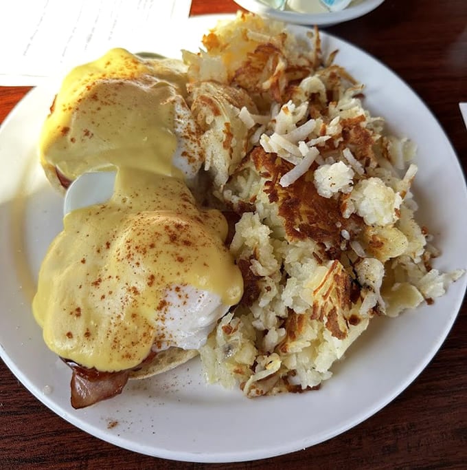 Eggs Benedict with hash browns so crispy they practically sing – this is morning done absolutely right.