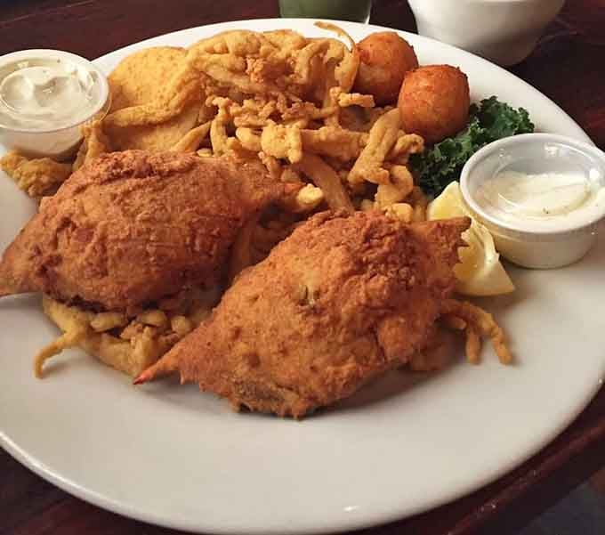 A seafood platter that answers the eternal question: "Why choose one when you can have it all?" The fried fish practically high-fives your taste buds.