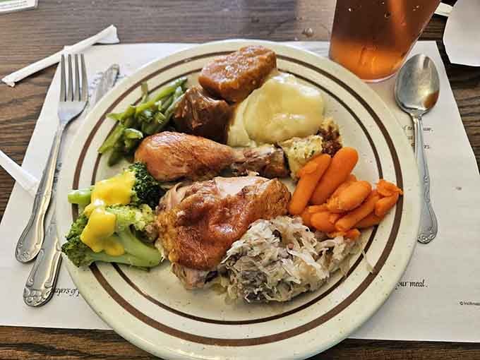 Golden fried chicken and colorful vegetables arranged like edible art on your personal canvas of satisfaction.