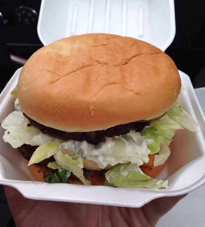 A burger so loaded with fresh toppings it requires both hands and zero shame to eat properly.