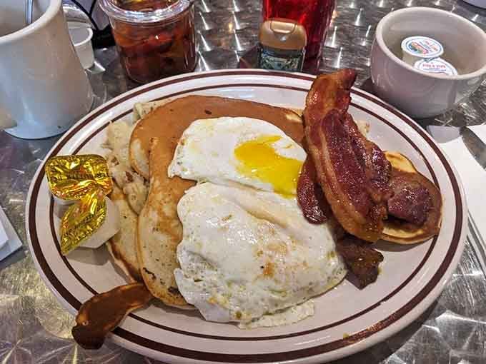 Pancakes, eggs, and bacon arranged like edible art, because breakfast this good deserves its moment to shine.