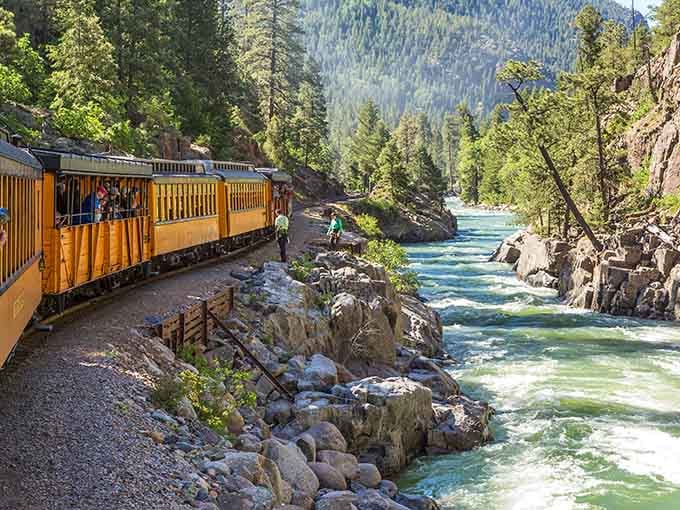The turquoise water below looks cold enough to make you grateful you're riding instead of swimming.