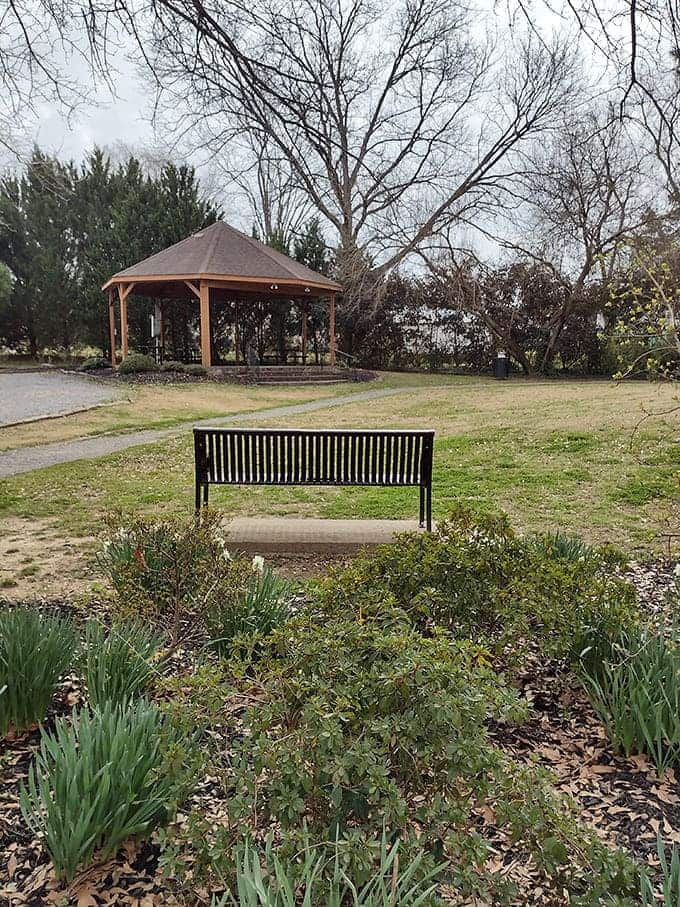 A quiet bench facing a gazebo creates one of those perfect moments where doing absolutely nothing becomes the most satisfying something.