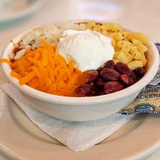 The Six Way Chili comes loaded with more toppings than a Christmas tree, and tastes infinitely better than pine needles.