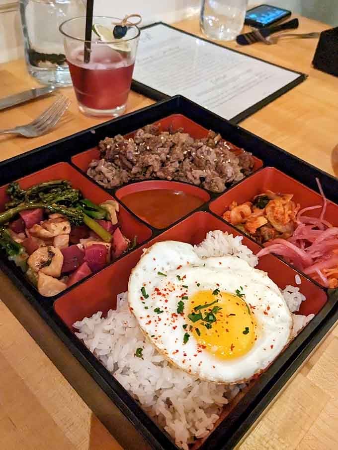 A bento box that turns lunch into a colorful adventure, complete with that perfectly runny egg yolk begging to be broken.