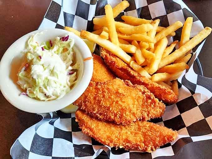 Golden-fried fish that shatters like glass with each bite, served with crispy fries and creamy coleslaw &ndash; comfort food that speaks fluent delicious.