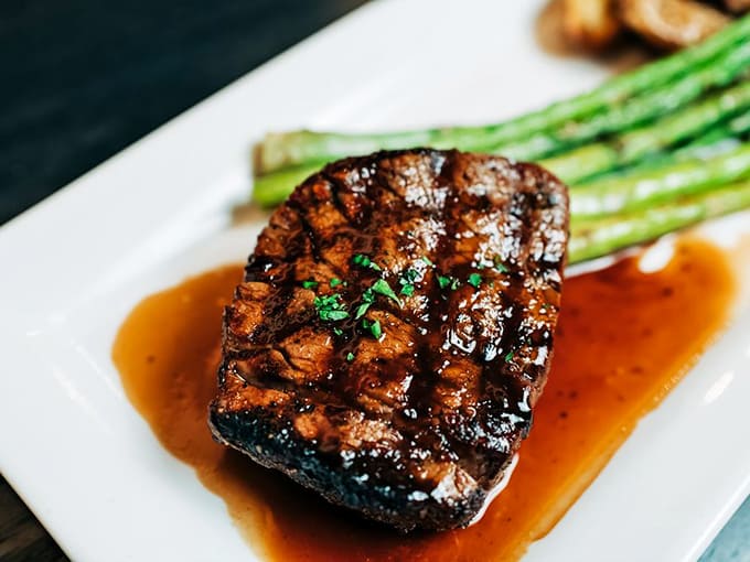 That perfect sear, that glistening sauce - this filet mignon isn't just cooked, it's been treated with the respect a good piece of beef deserves.