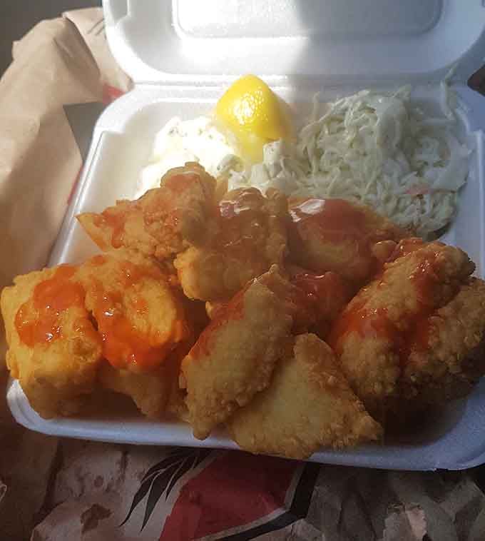 Golden fried seafood with coleslaw and rice, because sometimes you need to pretend you're being healthy before ordering hot dogs.