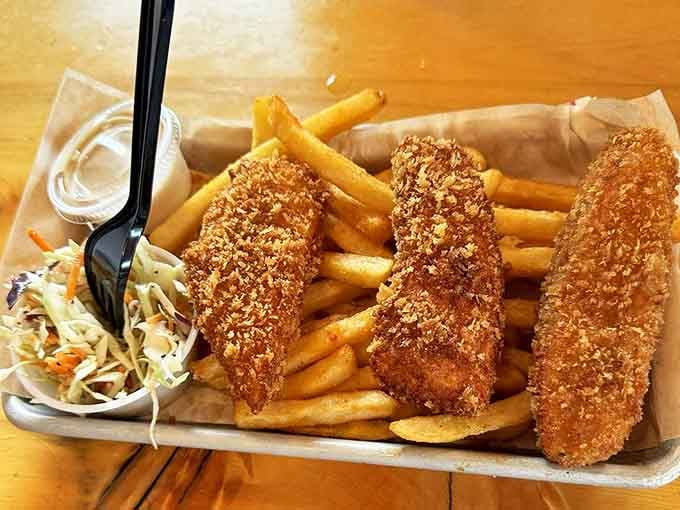 The golden-brown perfection of this fish and chips would make a British pub jealous. The crispy coating practically sings when you cut into it.