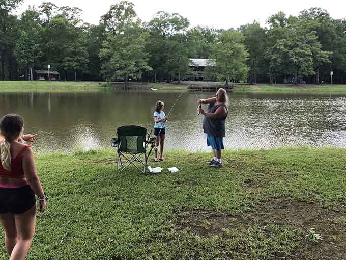 Fishing lessons that last a lifetime—this shoreline scene captures the perfect mix of patience, hope, and quality time that makes fishing special.