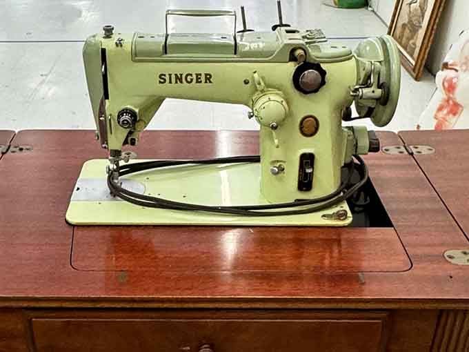 This mint-green Singer could still stitch circles around modern machines, built when "planned obsolescence" wasn't invented yet.
