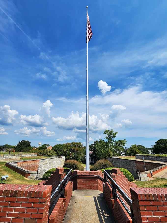 Old Glory snapping in the Chesapeake breeze above brick fortifications, the kind of patriotic view that never gets old.