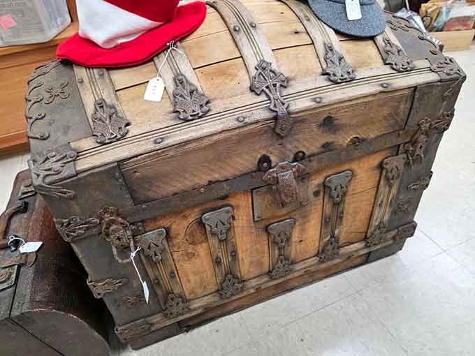 This steamer trunk has crossed more oceans than most people's passport stamps, stories locked inside every scratch.