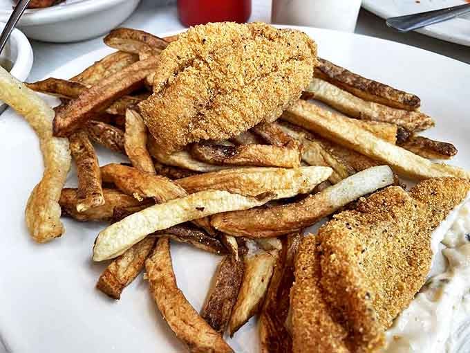 Cornmeal-crusted catfish fillets nestled among hand-cut fries&mdash;a plate that whispers "Arkansas comfort" louder than any roadside billboard.