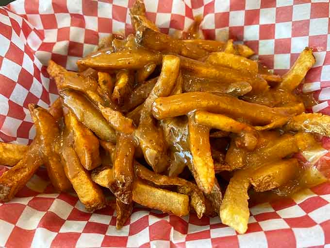 These golden fries glisten with that perfect crispy-outside, fluffy-inside magic that makes diets seem irrelevant.