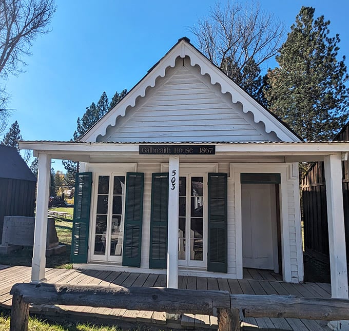 The Galbreath House, with its pristine white facade and green shutters, offers a glimpse into the refined side of frontier living.