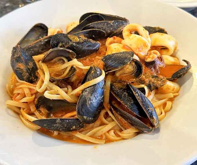 Those mussels opened up just for you, revealing tender meat bathed in sauce that demands crusty bread immediately.