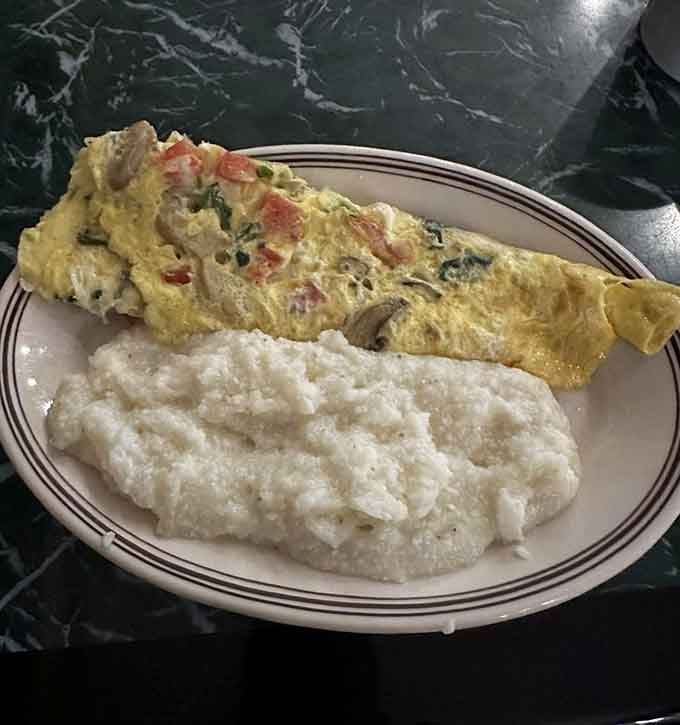 Creamy grits paired with a fluffy omelet, because some Southern traditions exist for very good reasons that become clear with every bite.