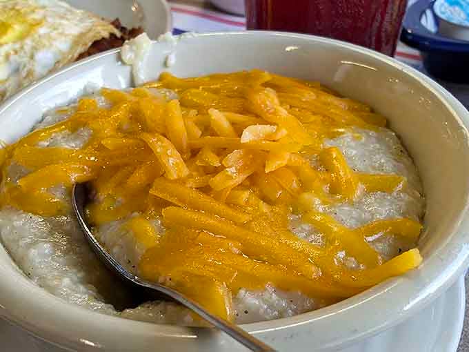 Cheese-topped grits that would make any Southerner nod in approval &ndash; creamy, comforting, and waiting for your spoon to dive right in.