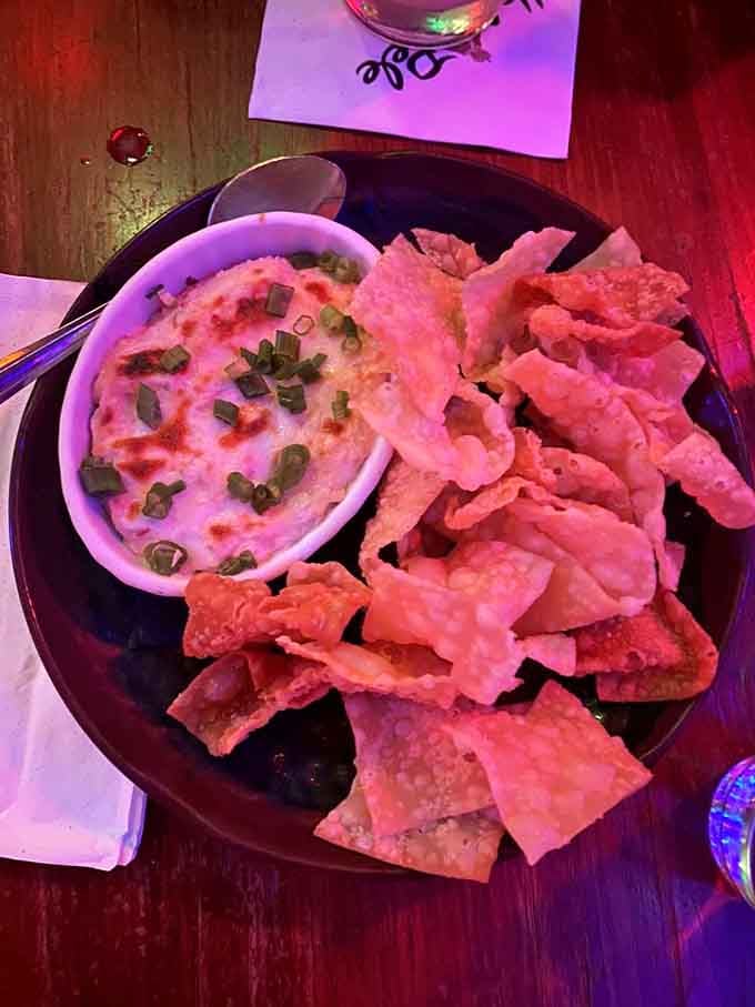 Crab rangoon dip with crispy wonton chips: the appetizer that'll have you fighting over the last bite.