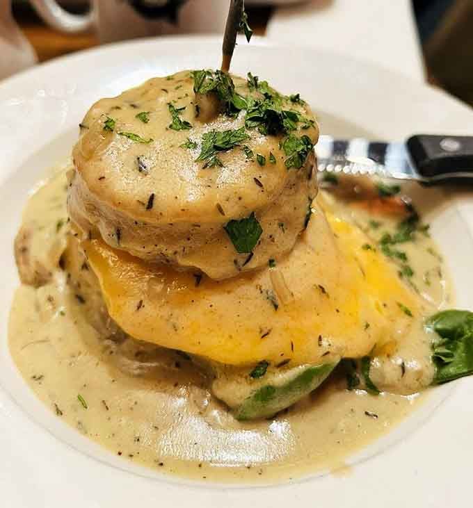 This towering Sammie with hollandaise cascading down is basically breakfast architecture at its finest and most delicious.